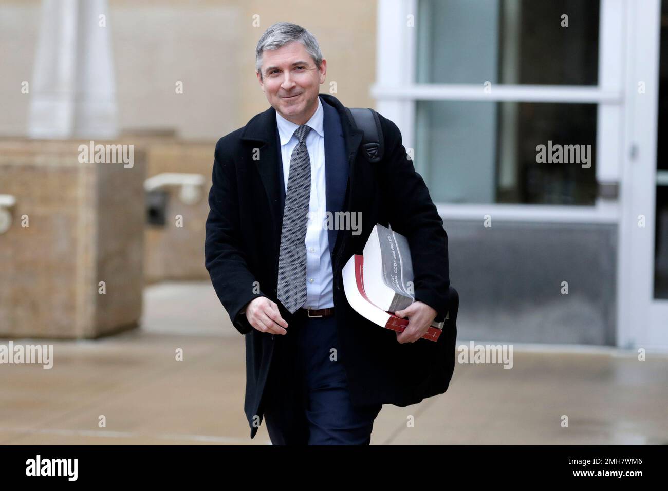 Assistant U.S. Attorney Thomas Windom leaves the U.S. District Court in ...