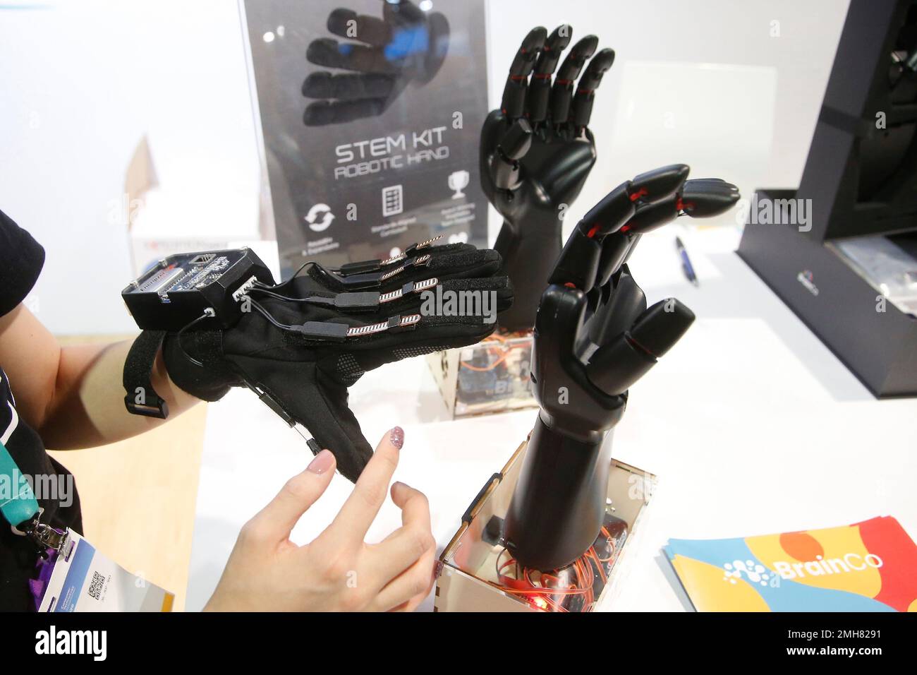 Yapei Li, of BrainCo, demonstrates their latest model of the AI-powered ...