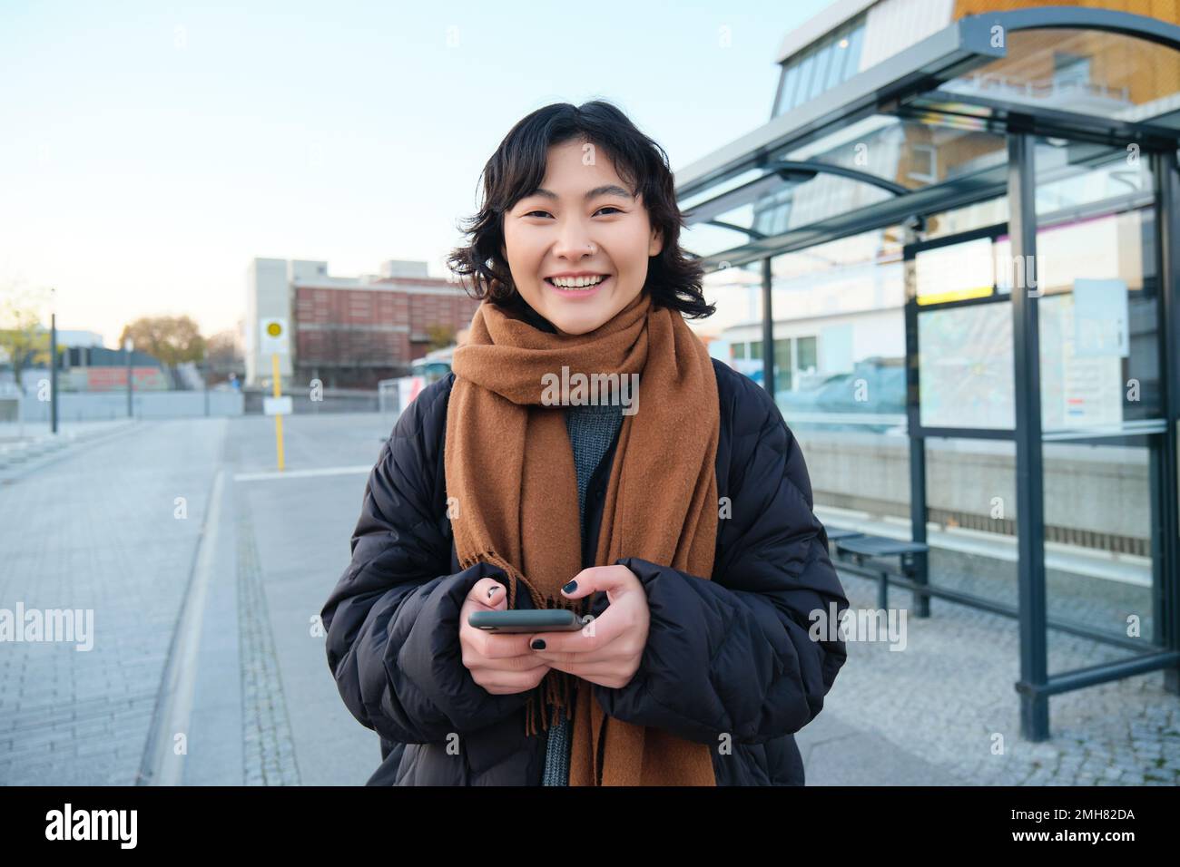 Chinese woman waiting bus stop hi-res stock photography and images - Alamy