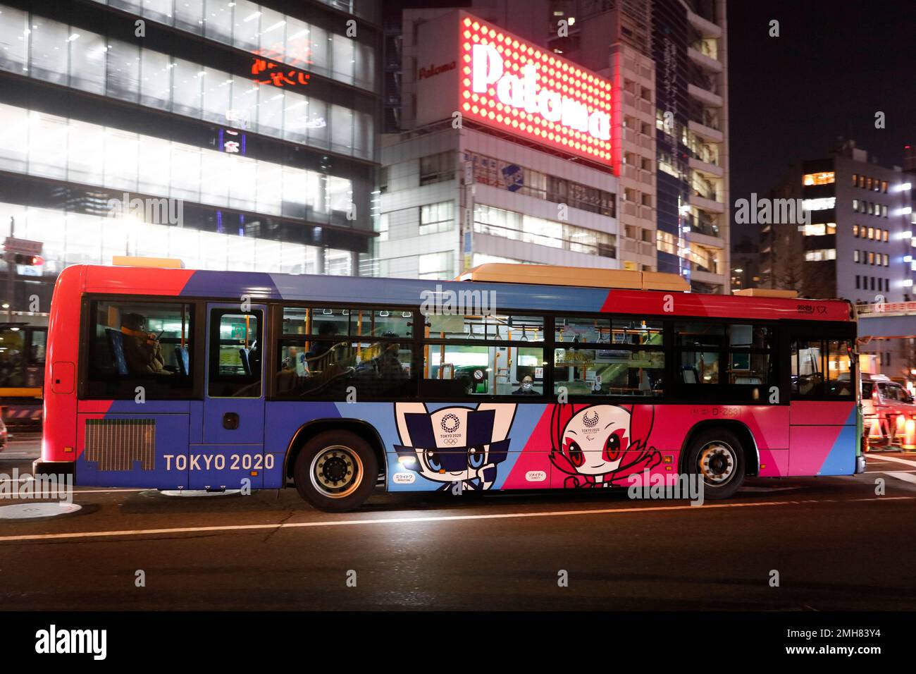 A bus adorned with the images of the Tokyo Olympic and Paralympic ...