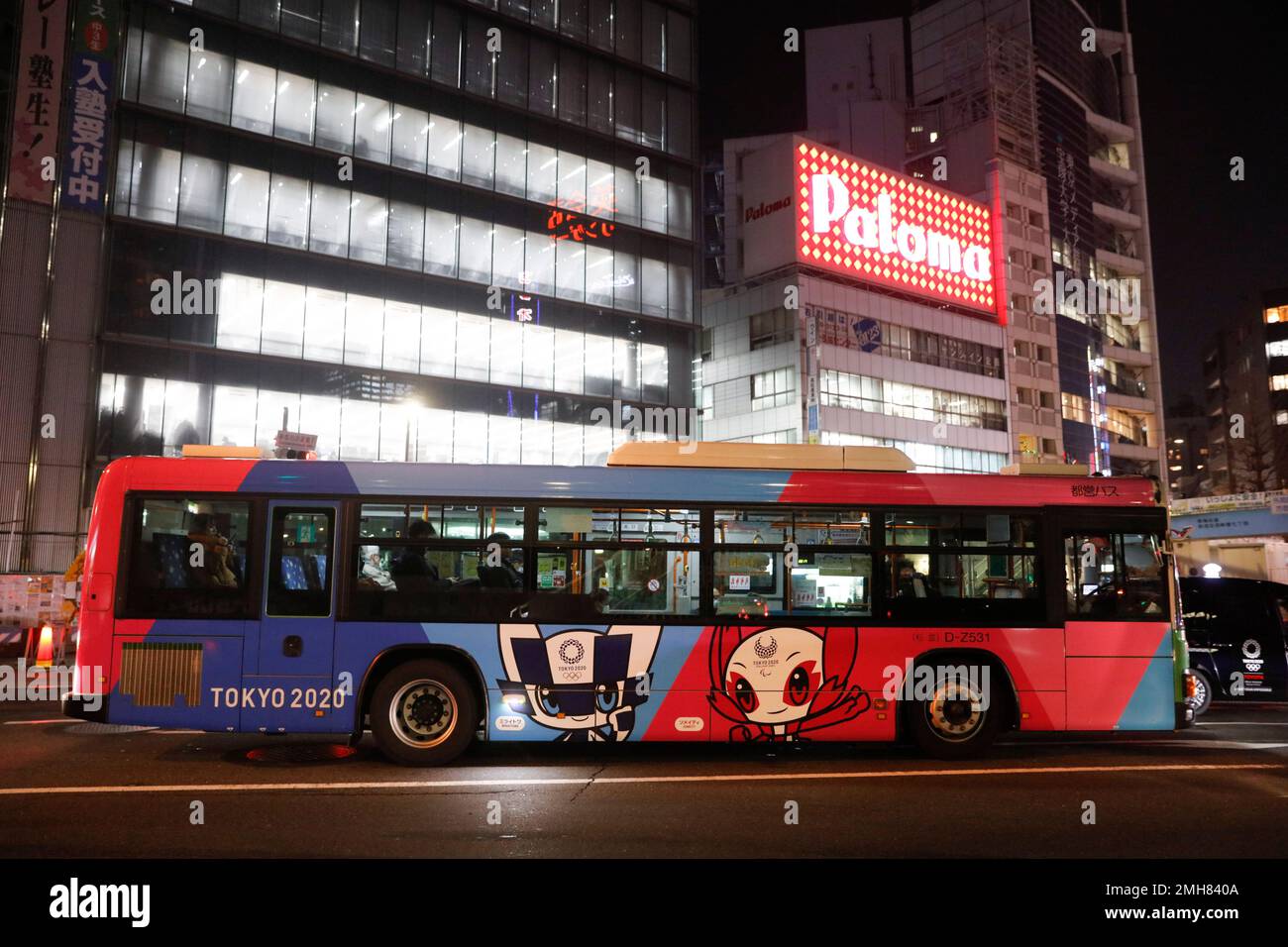 A bus adorned with the images of the Tokyo Olympic and Paralympic ...