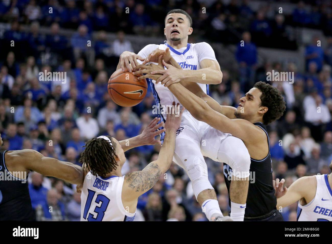 Creighton's Christian Bishop (13) and Marcus Zegarowski, center, and ...