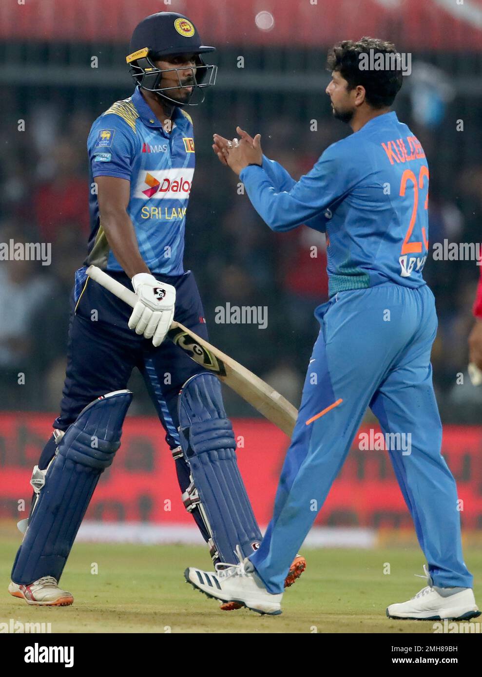 India's Kuldeep Yadav, right, celebrates the dismissal of Sri Lanka's ...