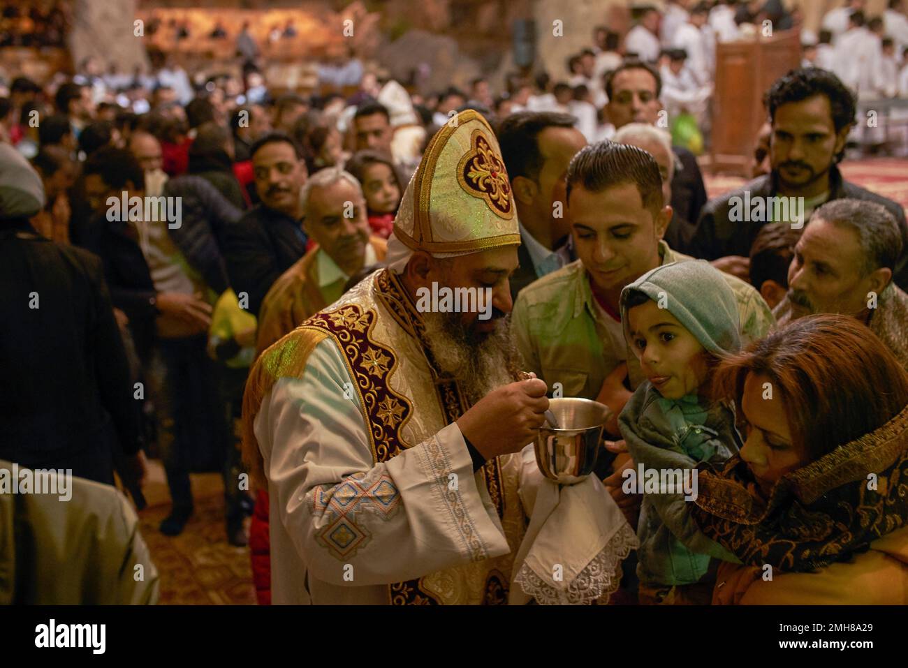 Coptic Christians attend Christmas eve mass at Saint Saman church in ...