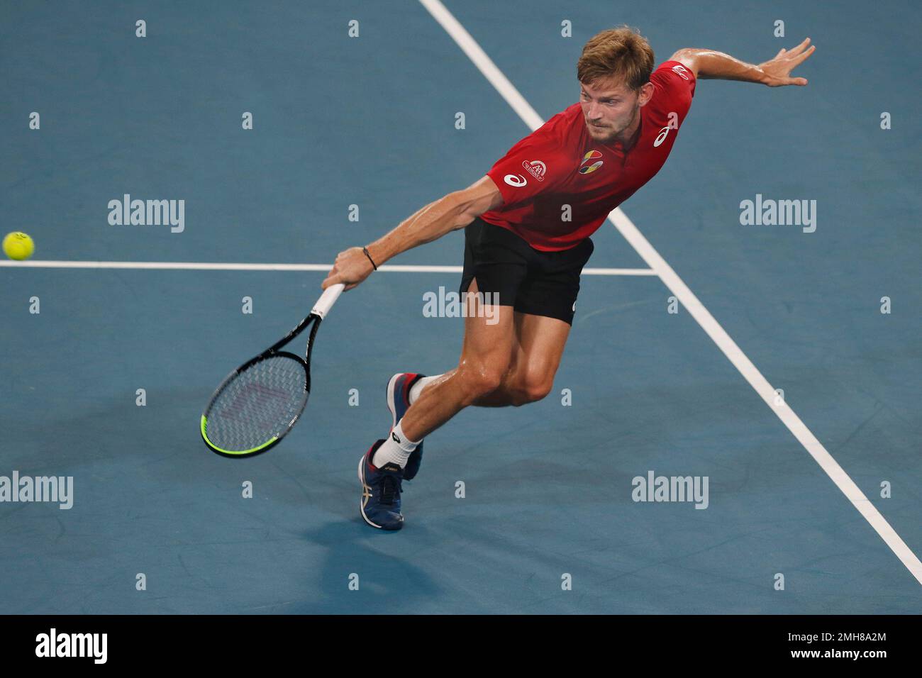 David Goffin of Belgium plays a shot against Grigor Dimitrov of ...