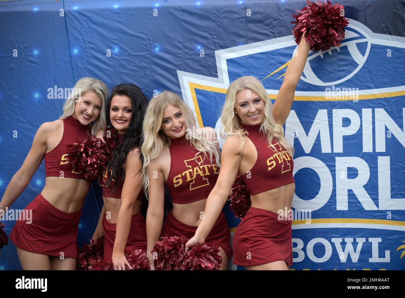 Iowa State dancers pose on the field before the Camping World Bowl NCAA ...