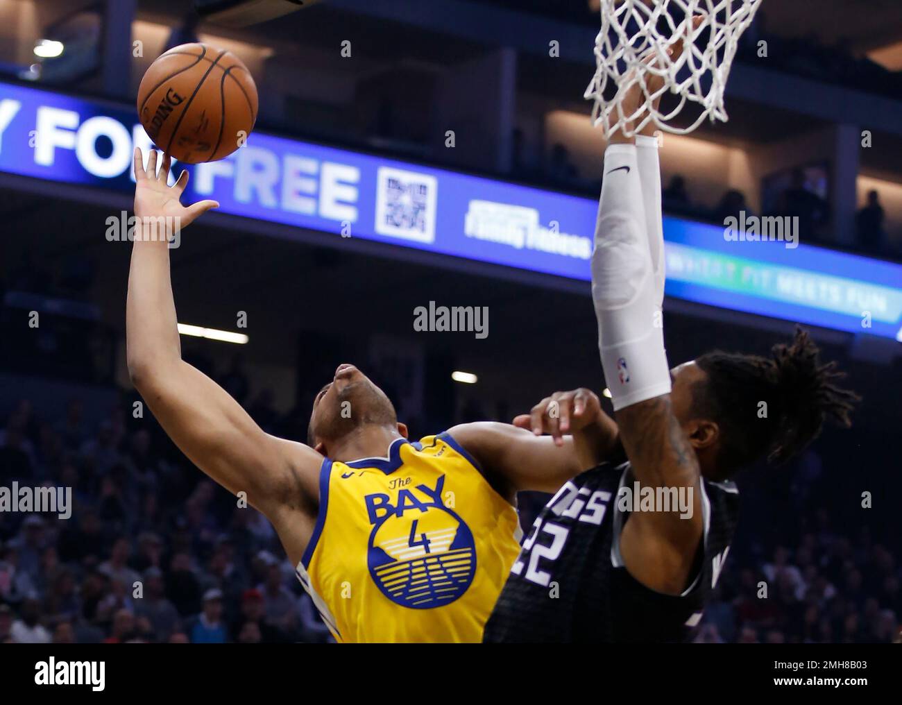 Golden State Warriors forward Omari Spellman, left, is fouled by ...