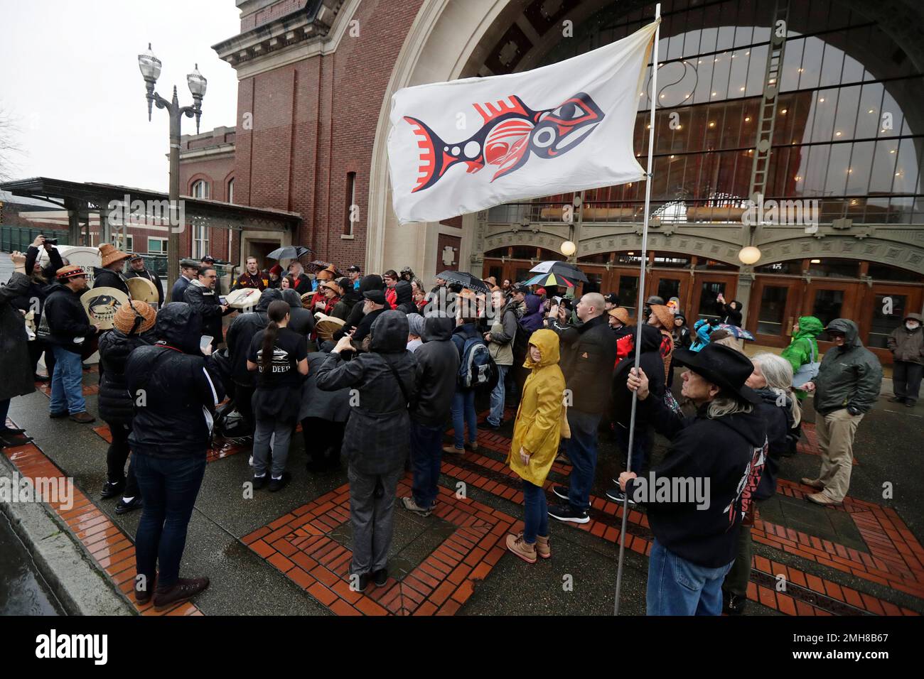 The flag of the Chinook Indian Nation is displayed in the wind Monday ...