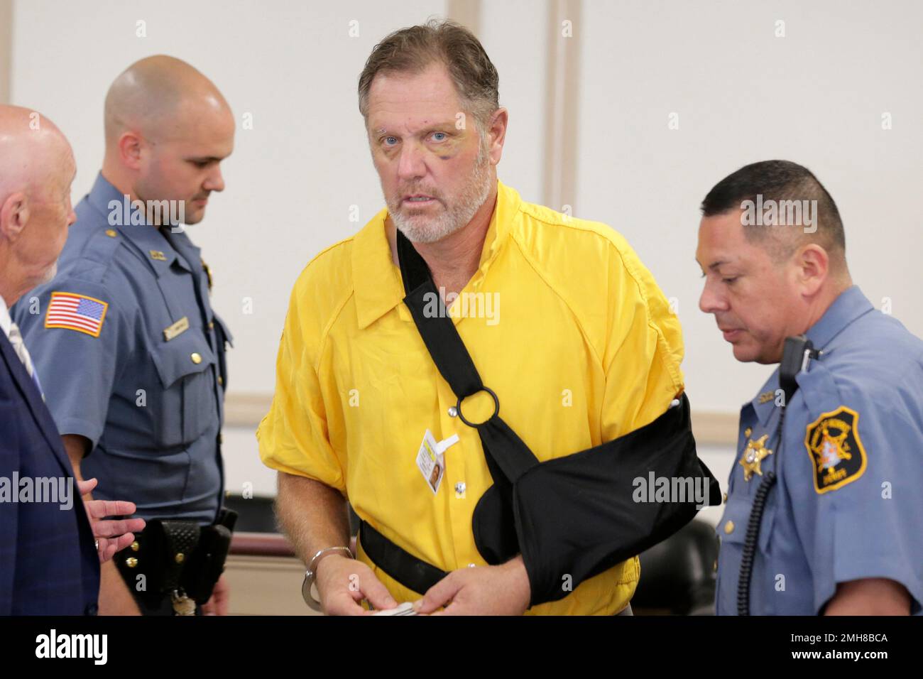 FILE - This Aug. 14, 2019, file photo, Michael Barisone, center ...