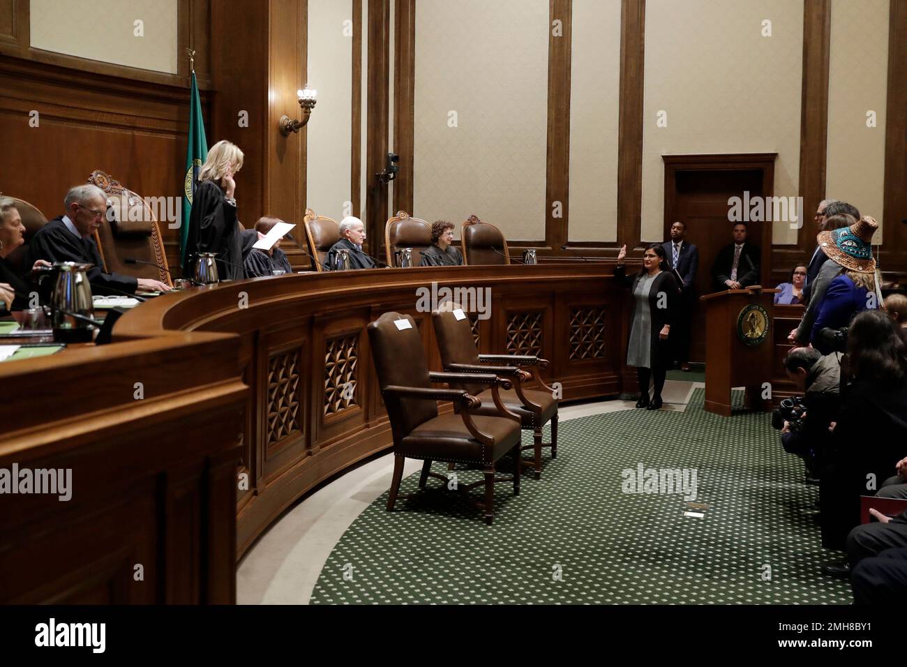 New Washington Supreme Court Justice Raquel Montoya-Lewis, center right ...