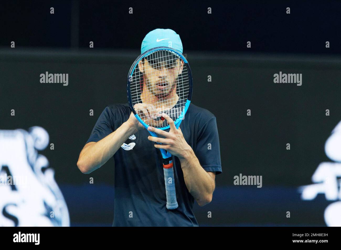 Franco Roncadelli of Uruguay is framed by his racquet as he faces ...