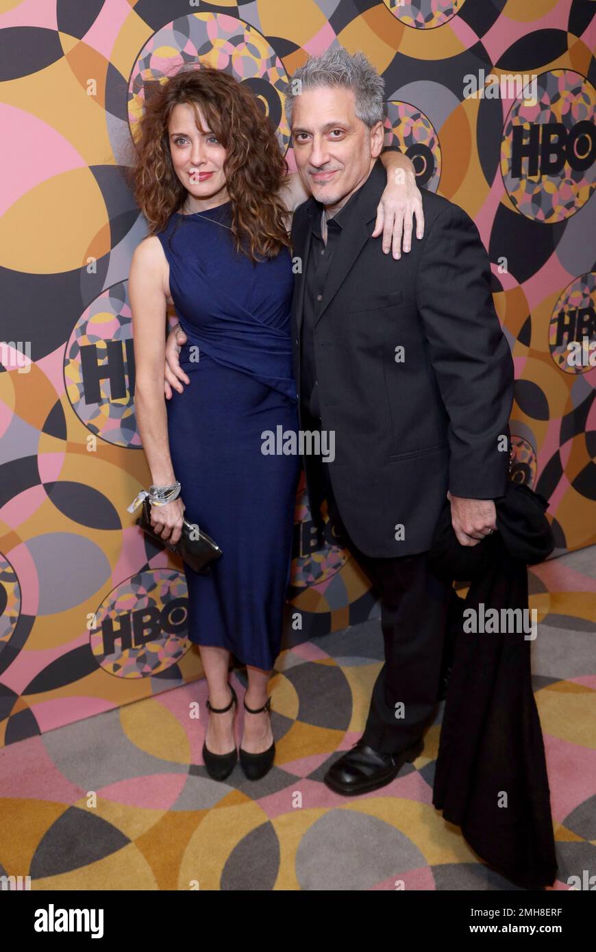Alanna Ubach, left, and Thom Russo arrive at the HBO Golden Globes ...