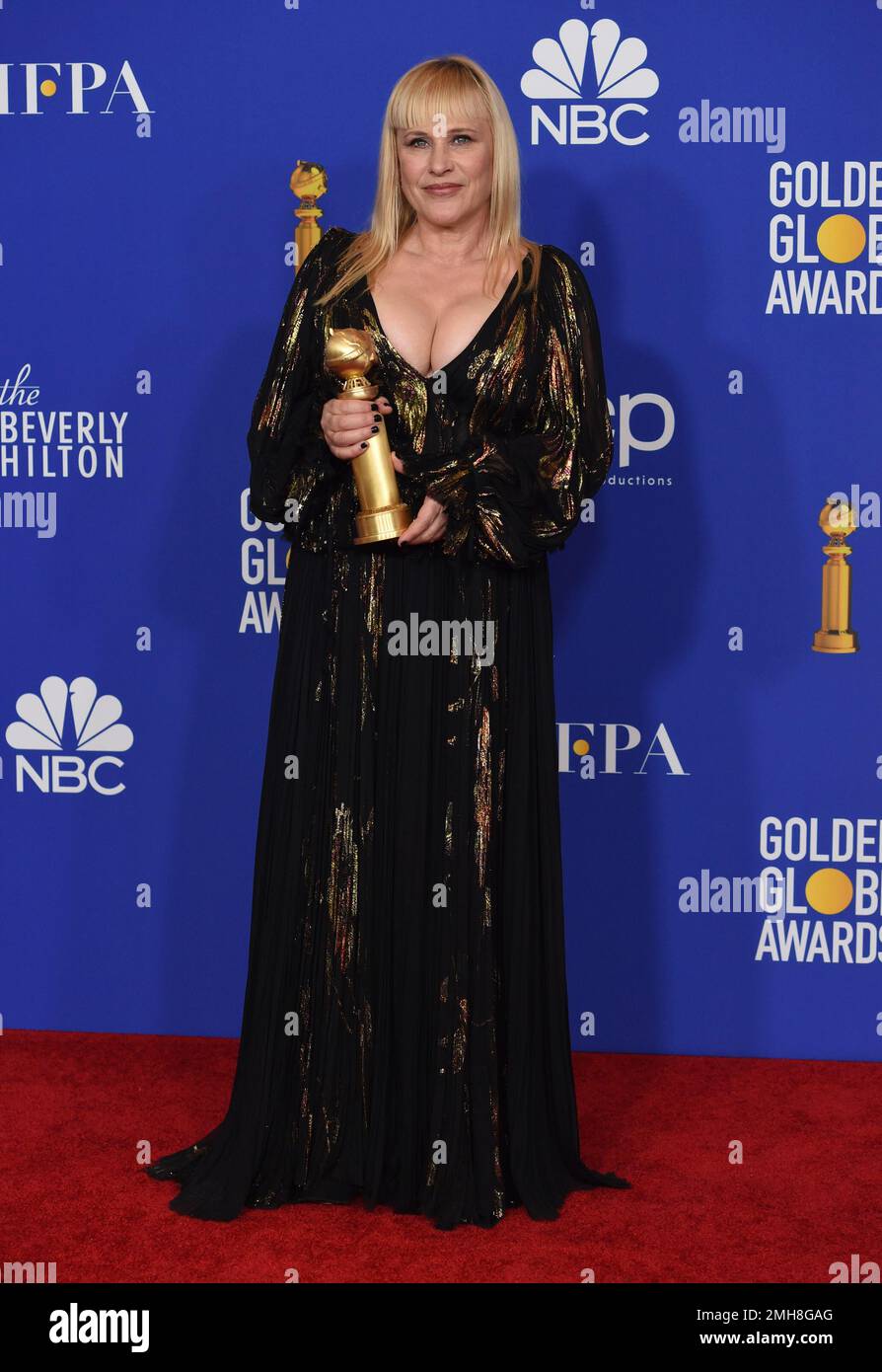 Patricia Arquette poses in the press room with the award for best ...