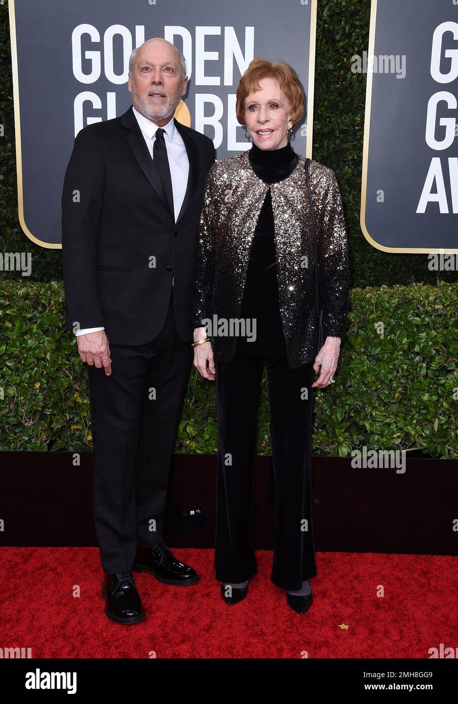 Brian Miller, left, and Carol Burnett arrive at the 77th annual Golden Globe Awards at the ...