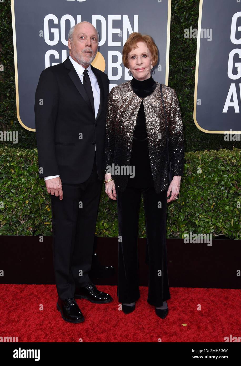 Brian Miller, left, and Carol Burnett arrive at the 77th annual Golden Globe Awards at the ...