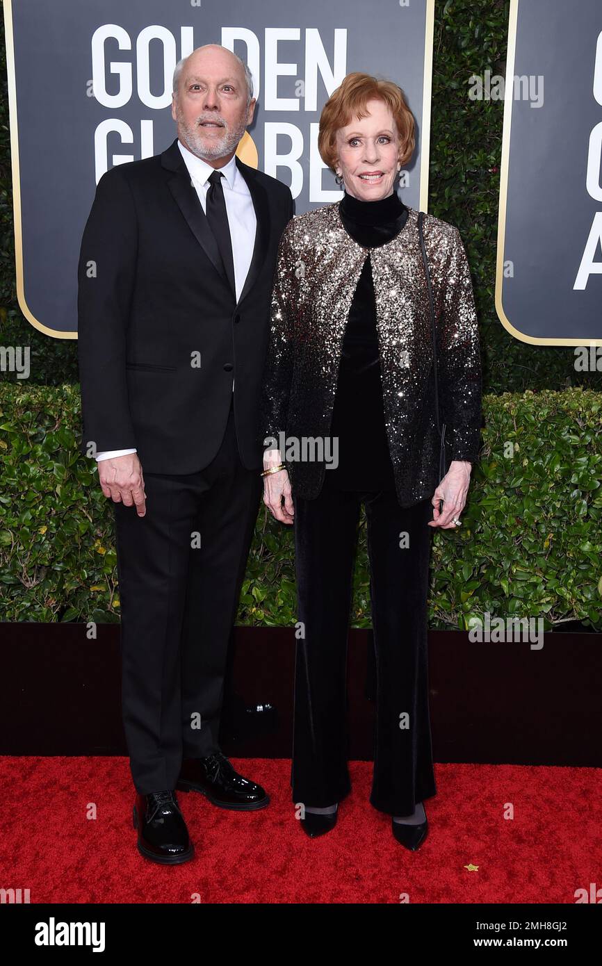 Brian Miller, left, and Carol Burnett arrive at the 77th annual Golden Globe Awards at the ...