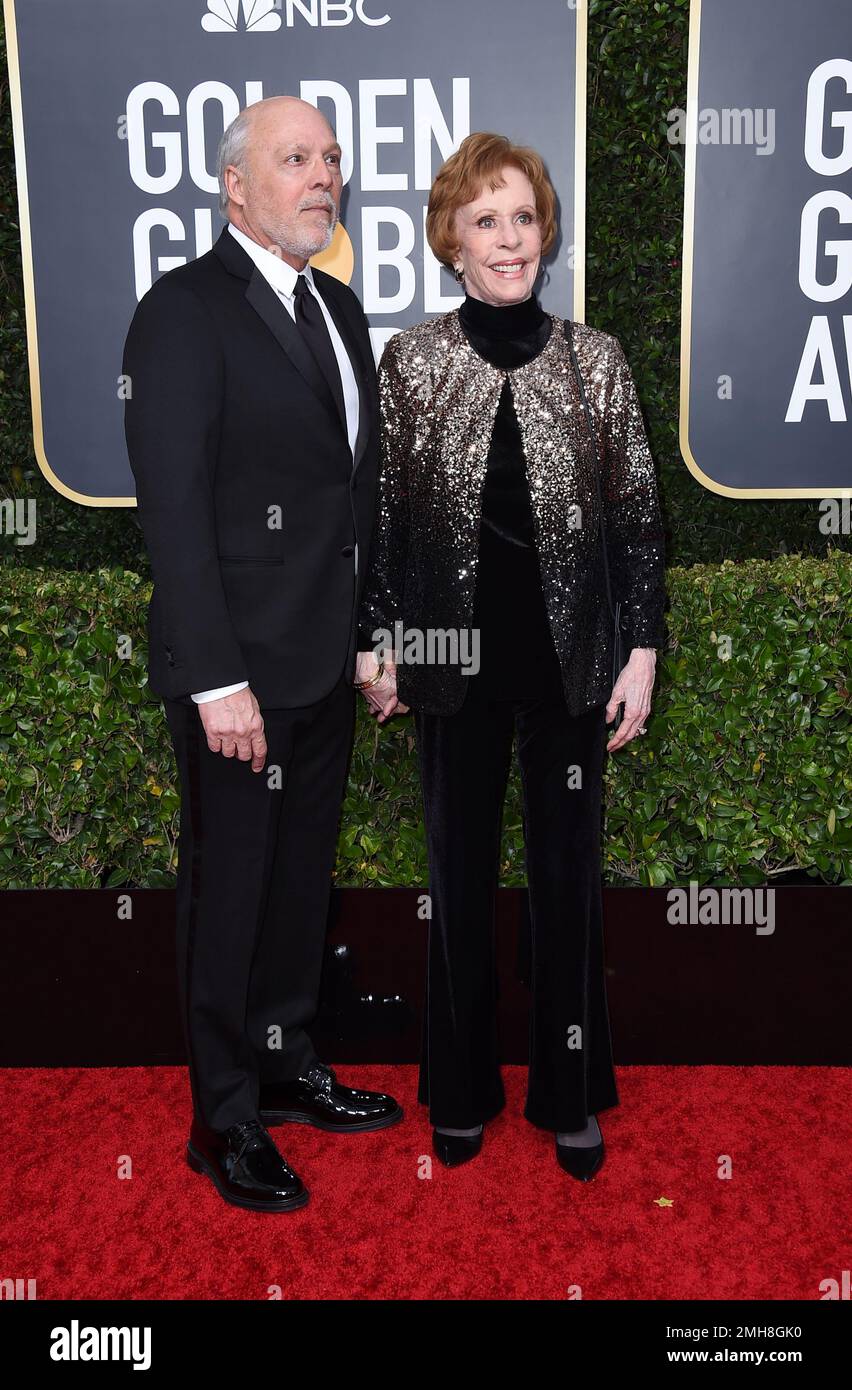 Brian Miller, left, and Carol Burnett arrive at the 77th annual Golden Globe Awards at the ...