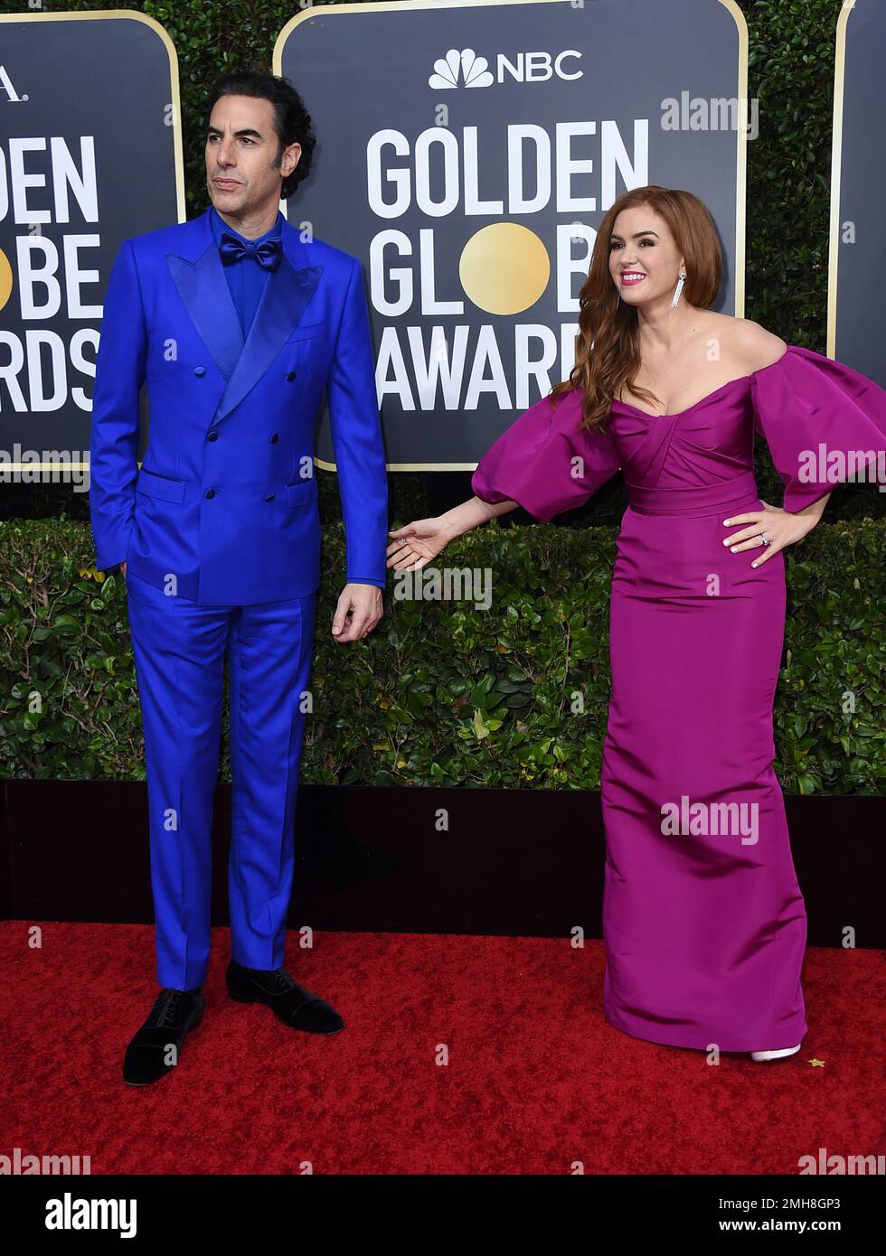 Sacha Baron Cohen, left, and Isla Fisher arrive at the 77th annual ...