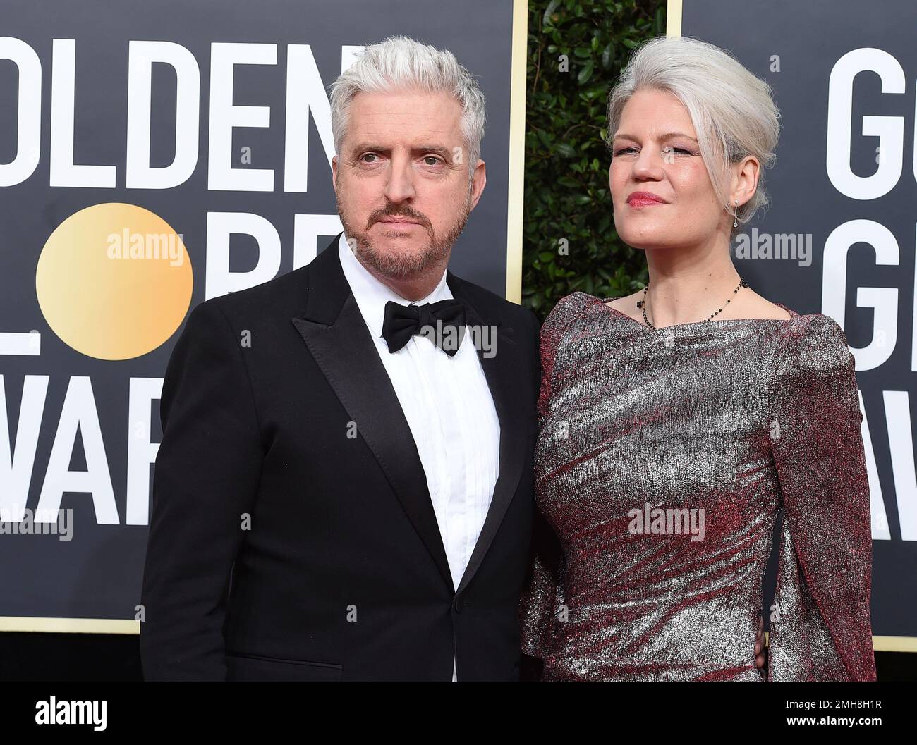 Anthony McCarten, left, and Eva Maywald arrive at the 77th annual ...