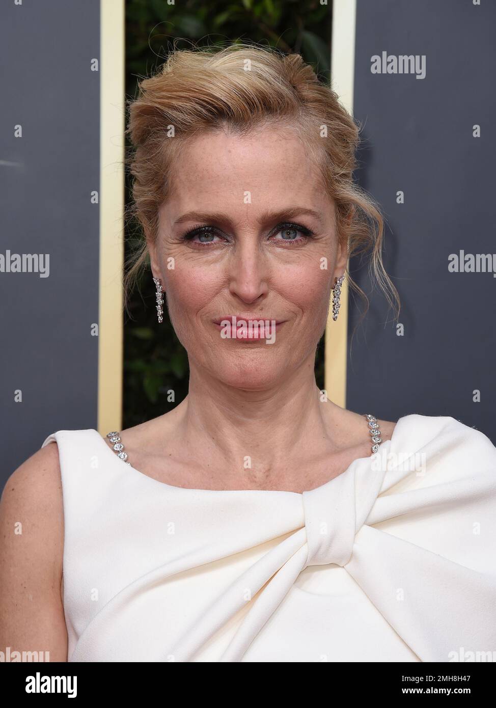 Gillian Anderson arrives at the 77th annual Golden Globe Awards at the ...