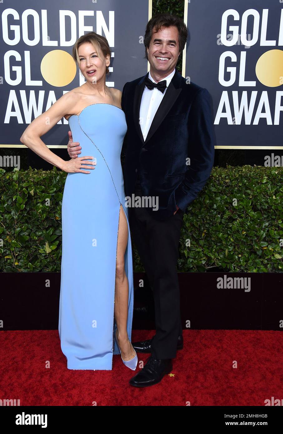 Renee Zellweger, left, and Rupert Goold arrive at the 77th annual ...