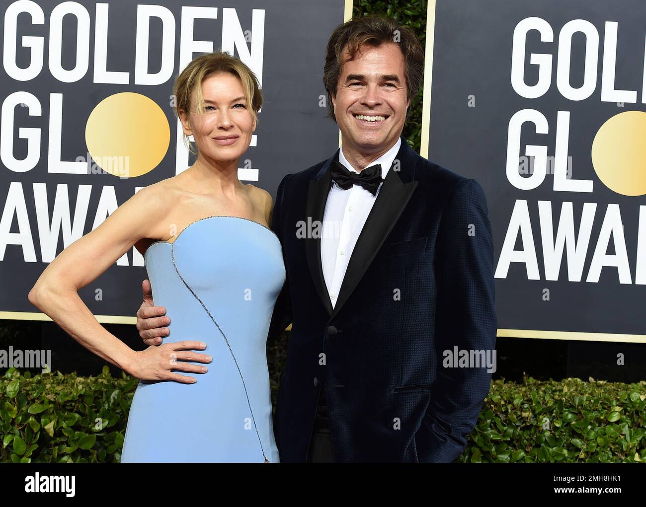Renee Zellweger, left, and Rupert Goold arrive at the 77th annual ...
