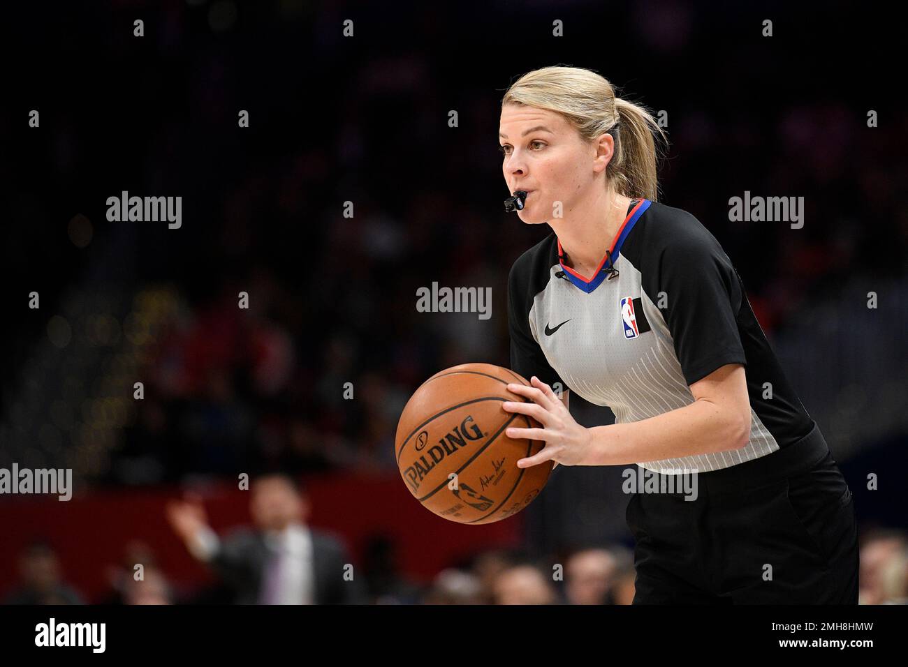 Referee Jenna Schroeder holds the ball during the first half of an NBA ...