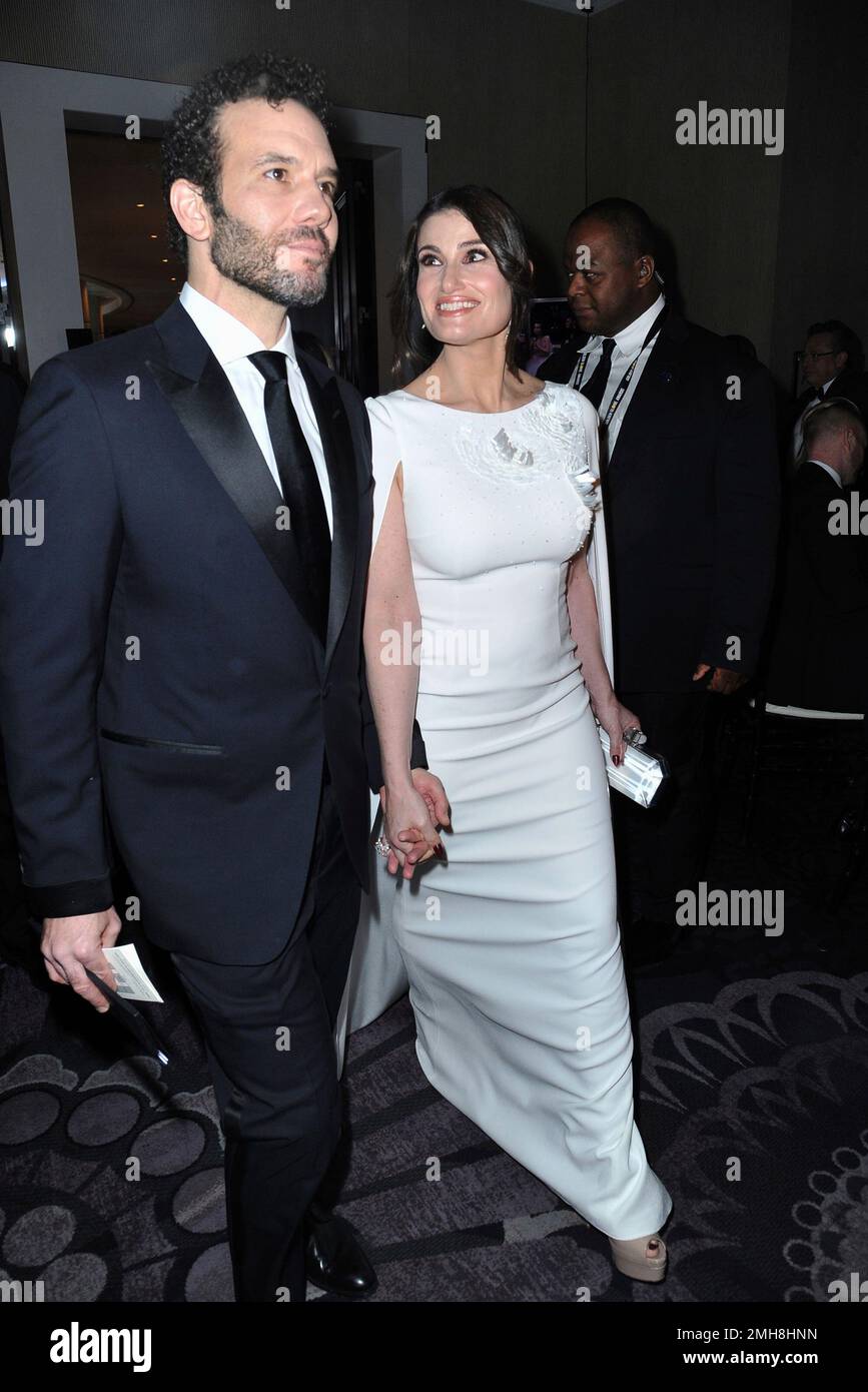 Aaron Lohr, left, and Idina Menzel attend the 77th annual Golden Globe ...