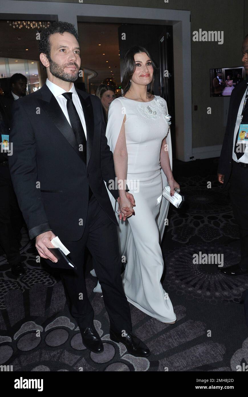 Aaron Lohr, left, and Idina Menzel attend the 77th annual Golden Globe ...