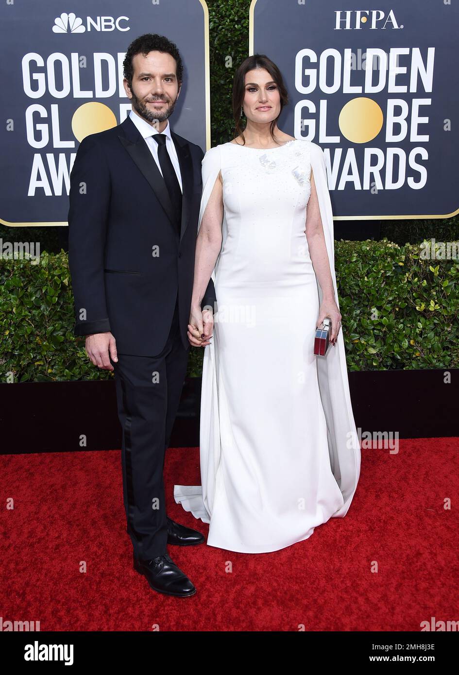 Aaron Lohr, left, and Idina Menzel arrive at the 77th annual Golden ...