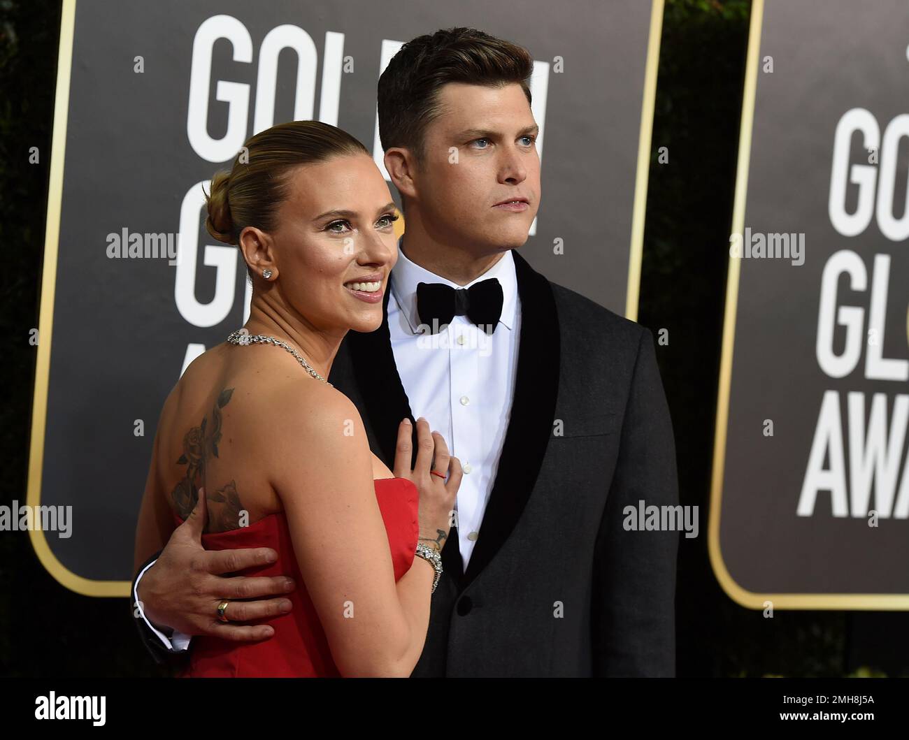 Scarlett Johansson, left, and Colin Jost arrive at the 77th annual ...