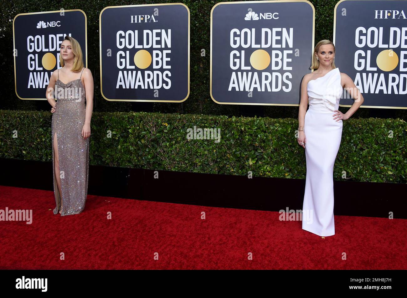 Saoirse Ronan, left, and Reese Witherspoon arrive at the 77th annual ...