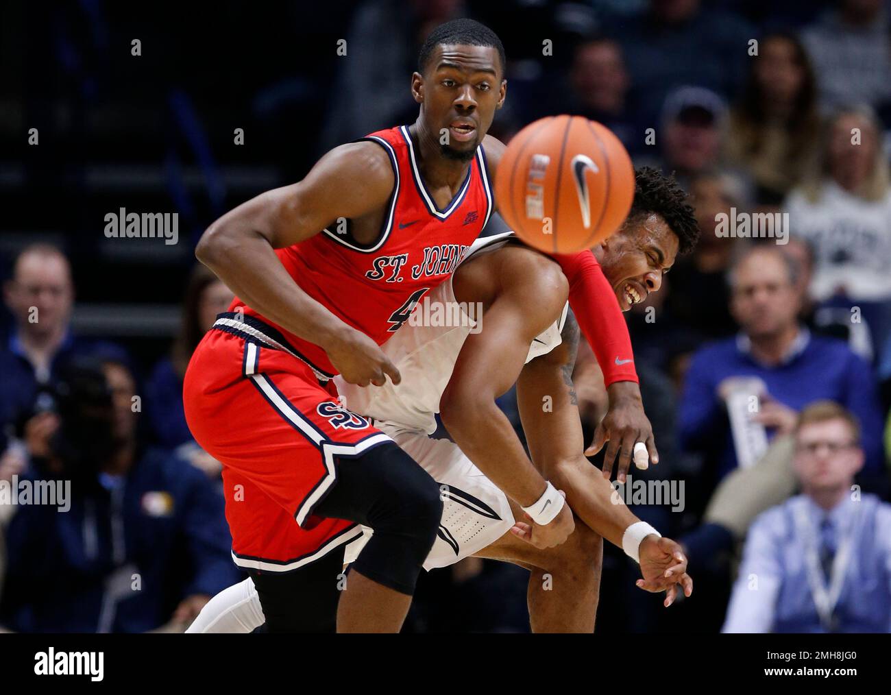 St. John's guard Greg Williams Jr., left, and Xavier guard Paul Scruggs ...