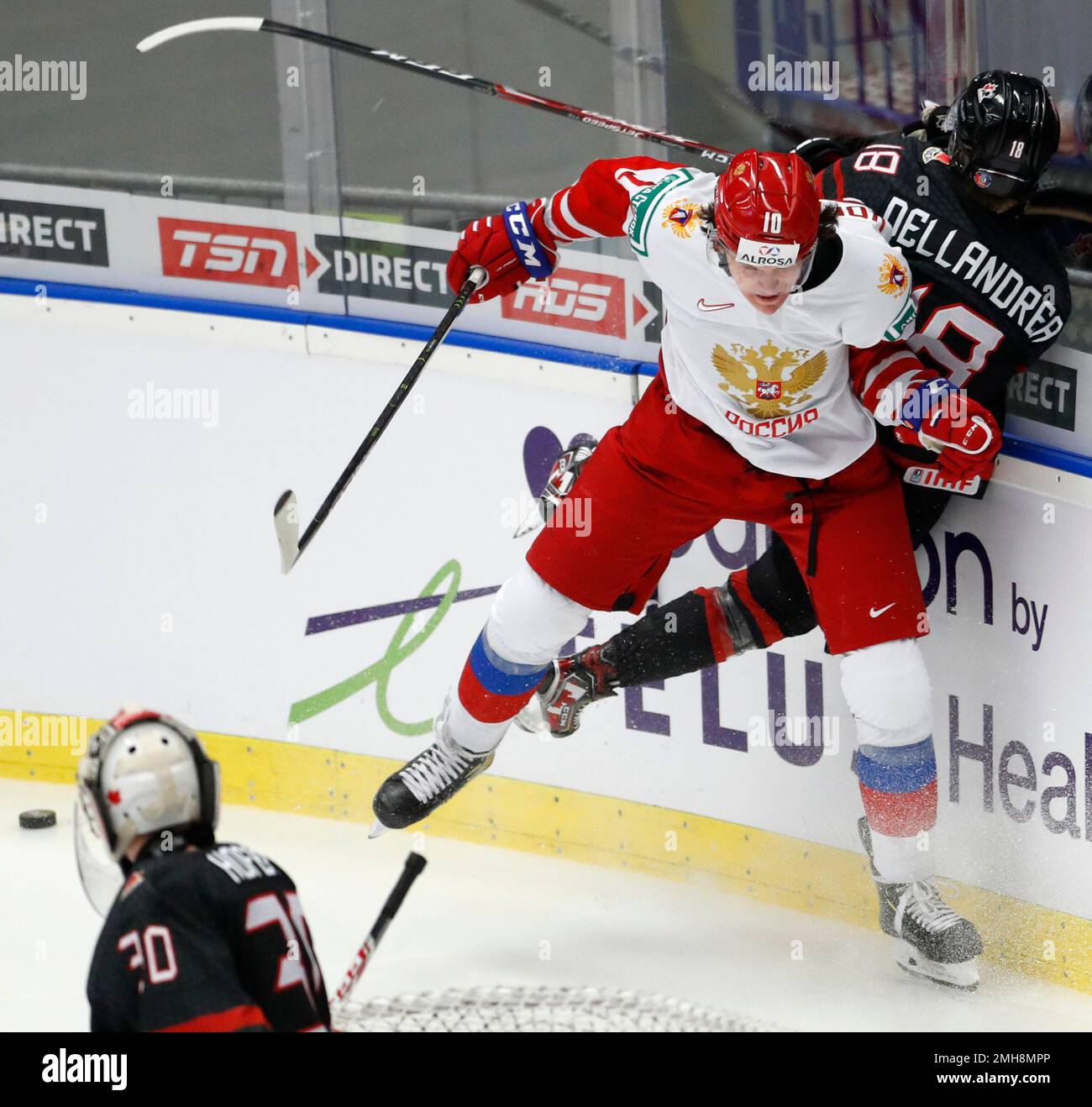 Russia's Dmitri Voronkov, left, checks Canada's Ty Dellandrea during ...