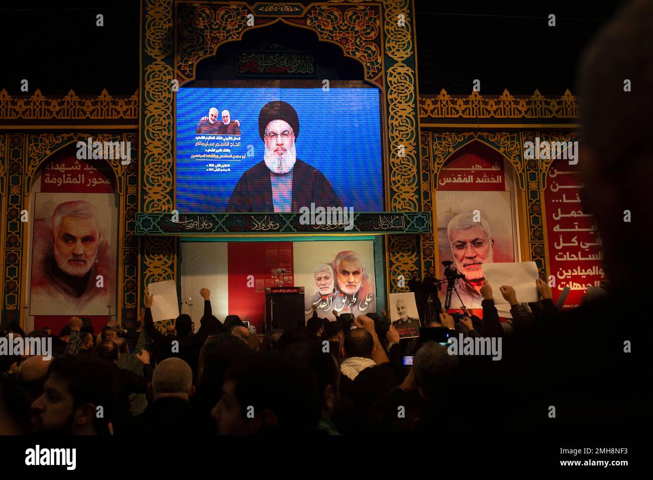 Supporters of Hezbollah leader Sayyed Hassan Nasrallah chant slogans as ...