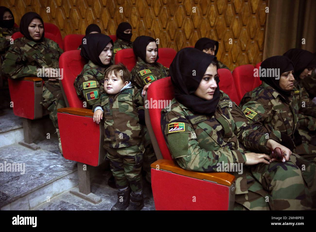 Newly graduated Afghan female National Army soldiers attend their ...