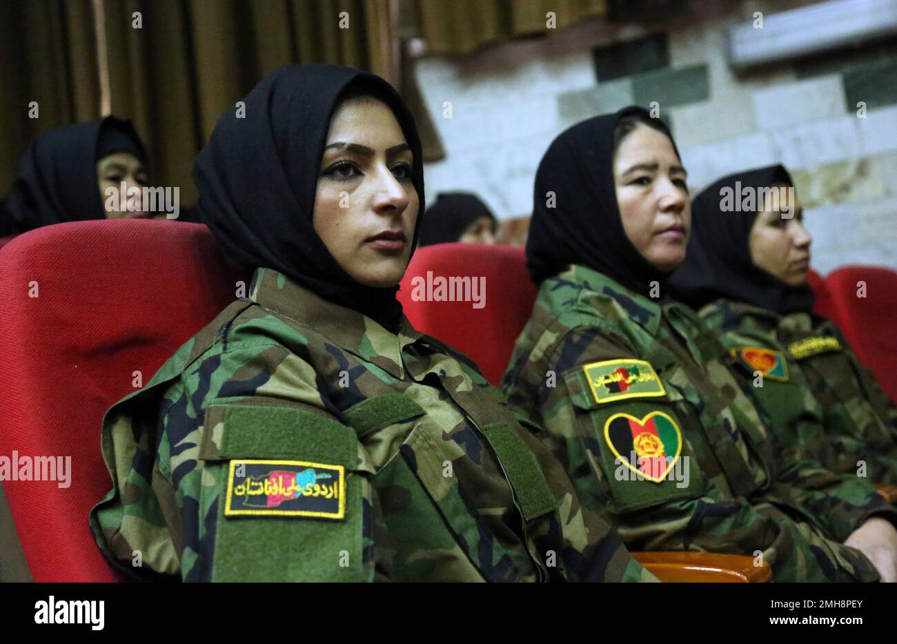 Newly graduated Afghan female National Army soldiers attend their ...
