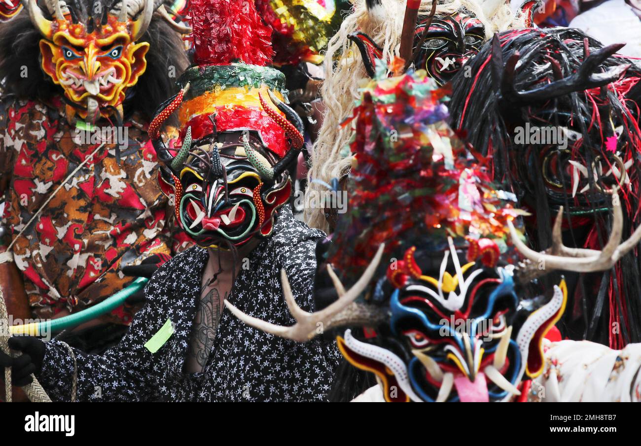 Devils dance during the parade of devils for the annual "La Diablada ...