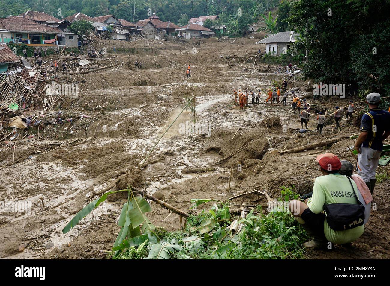 Rescuers search for missing people at a village hit by landslide in ...