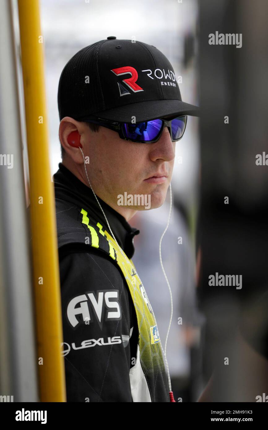 Kyle Busch waits in his pit stall for a turn to drive during testing ...