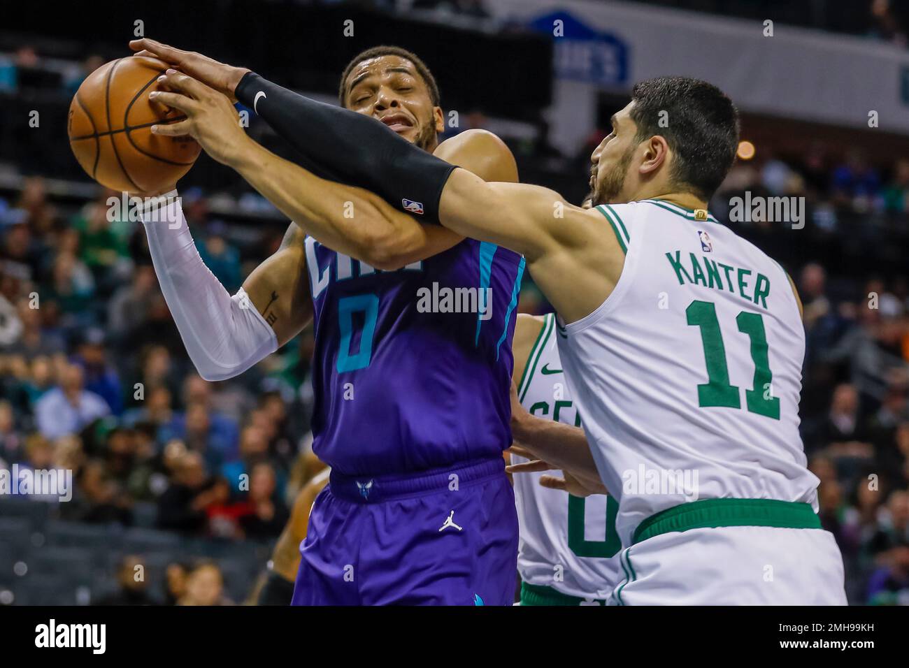 Charlotte Hornets' Miles Bridges (0) gets fouled hard by Boston Celtics ...