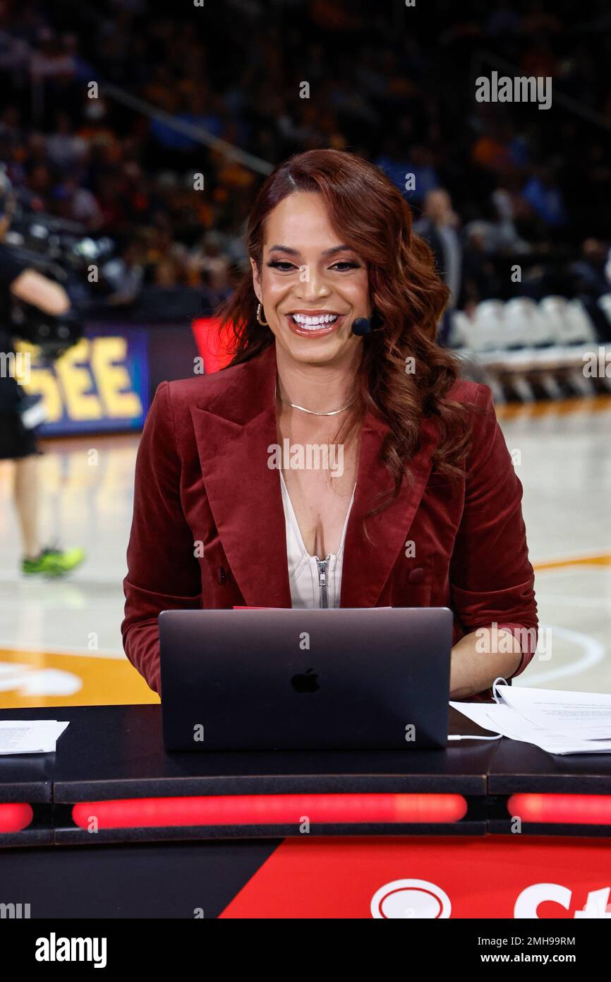 Elle Duncan sits on the set at an NCAA college basketball game between ...