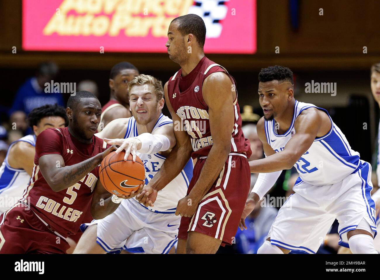 Boston College guard Jay Heath (5) is pressured by Duke forward Jack ...