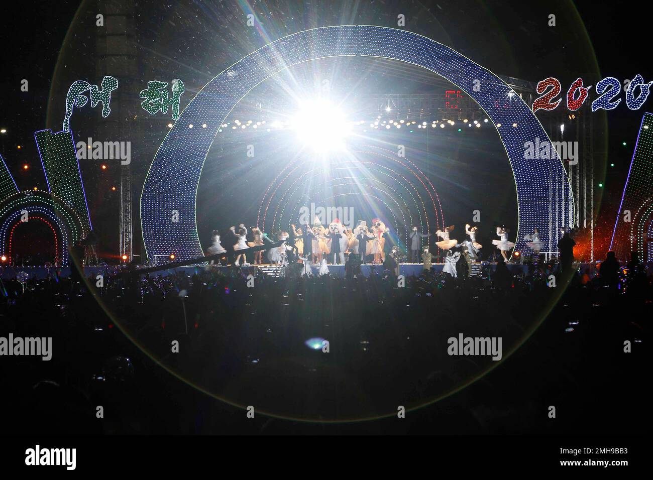 Pyongyang citizens enjoy the performances by artists during a New Year ...
