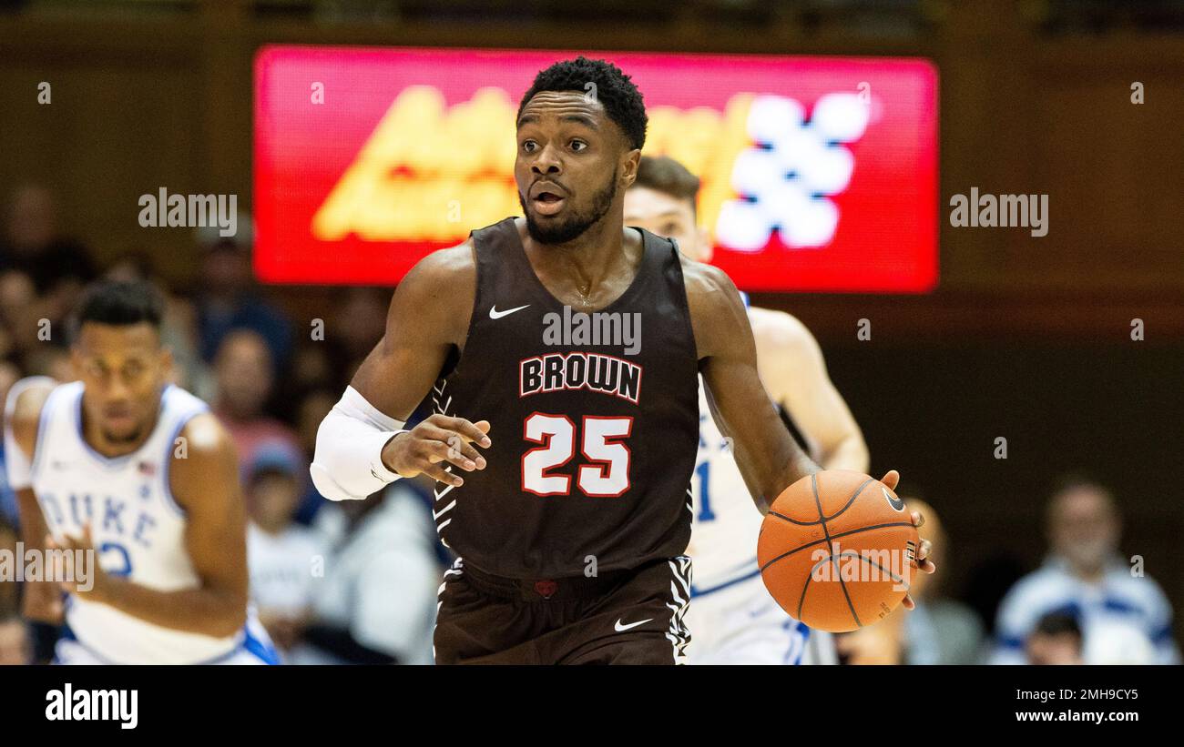 Brown's Tamenang Choh (25) handles the ball during an NCAA college ...