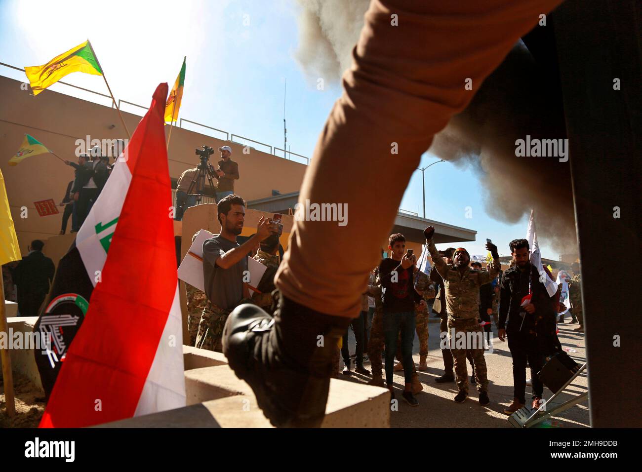 Protesters burn property in front of the U.S. embassy compound, in ...