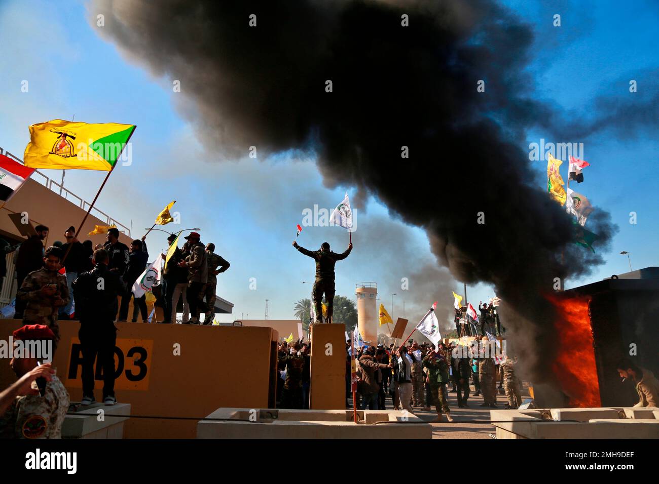 Protesters burn property in front of the U.S. embassy compound, in ...