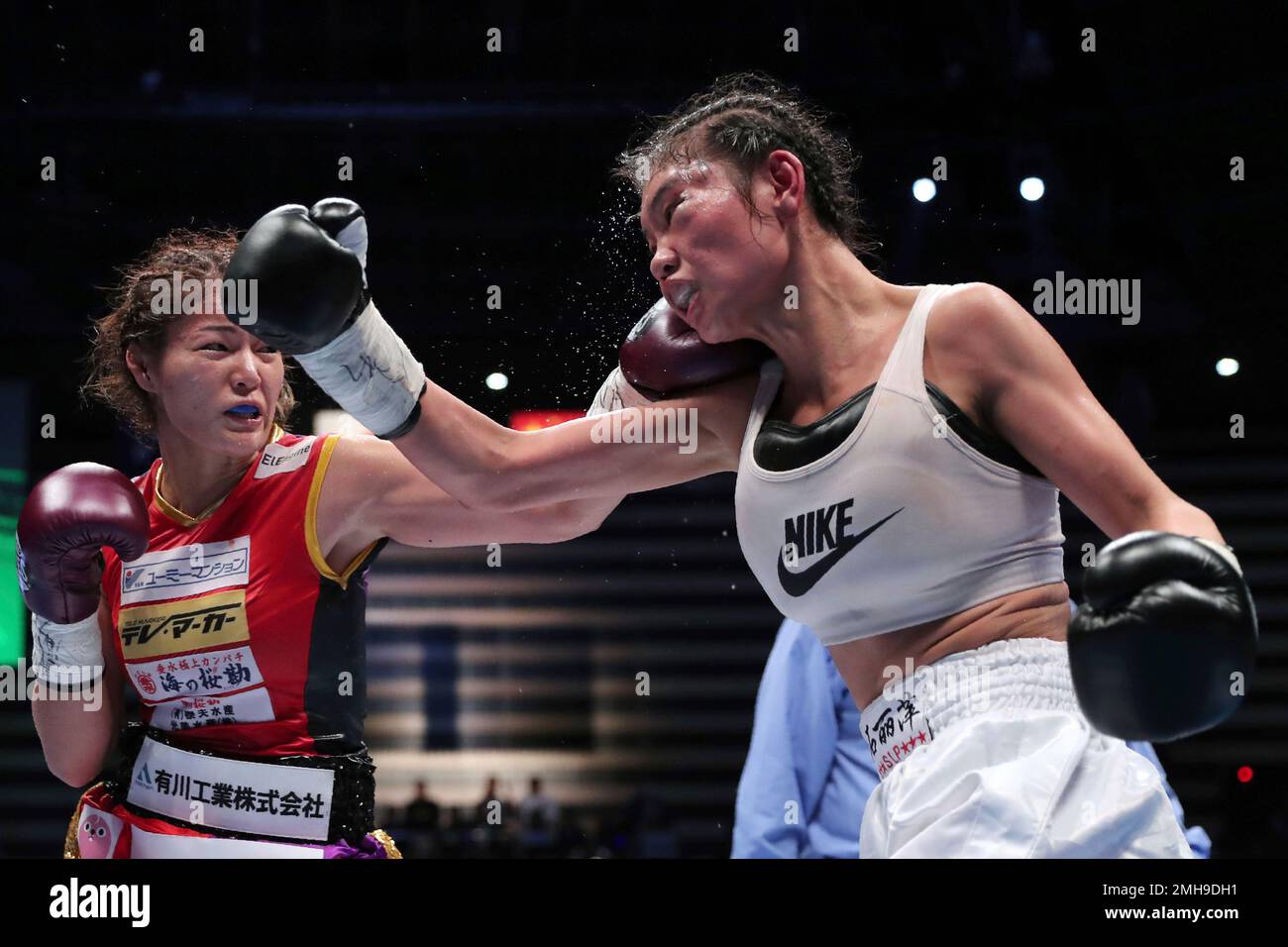 Japanese champion Miyo Yoshida, left, lands a left on the face of ...