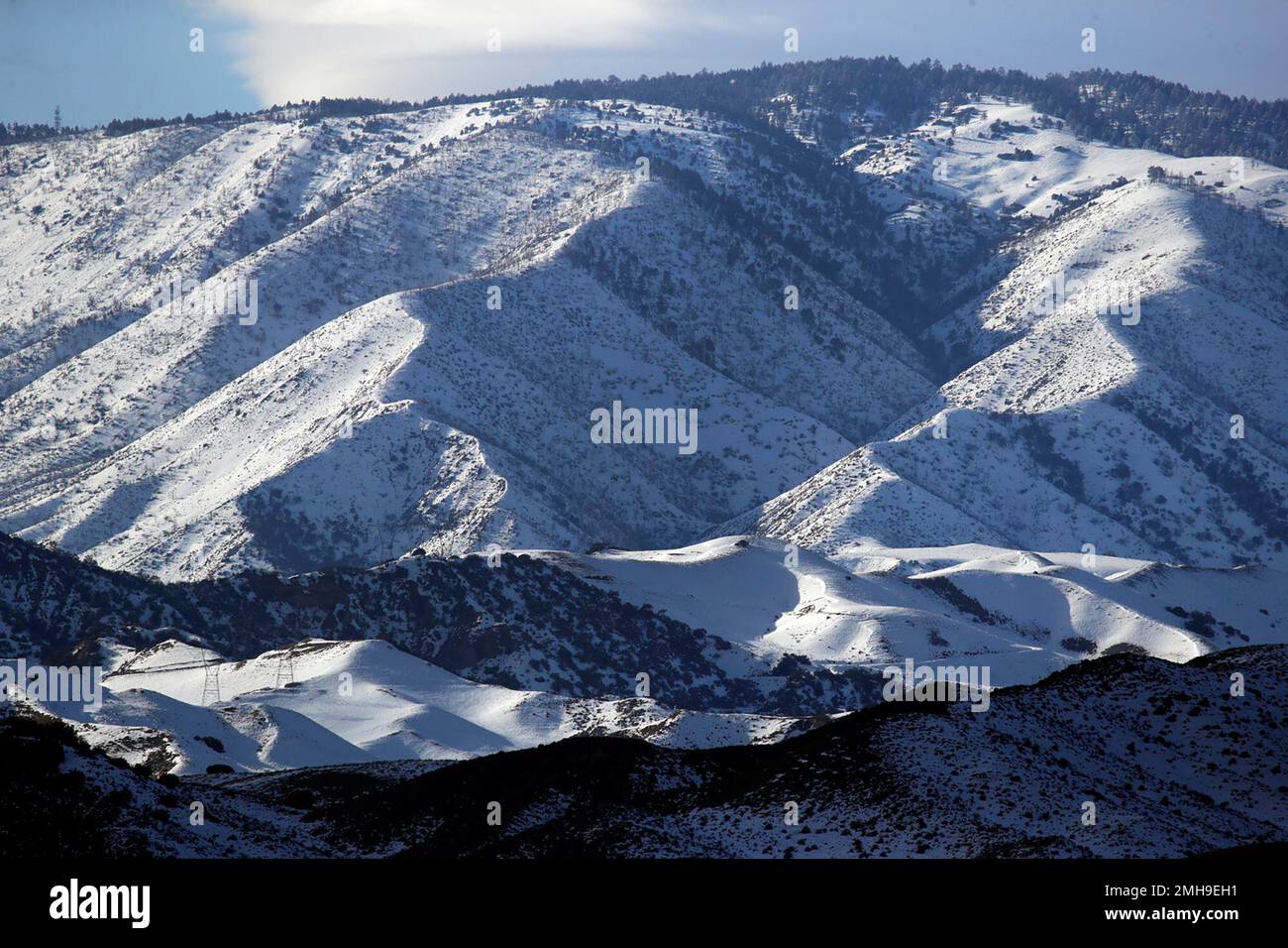 Snow covers a mountainside along Interstate 5 after a series of storms ...