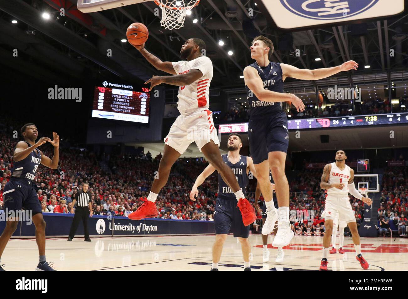 Dayton guard Trey Landers, left, shoots against North Florida forward ...